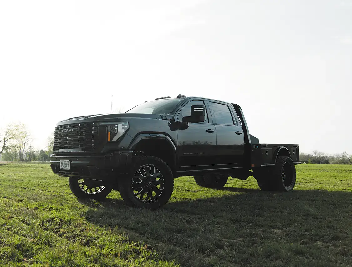 Lifted 2024 GMC 3500 Duramax with CM Flatbed - Diesel World